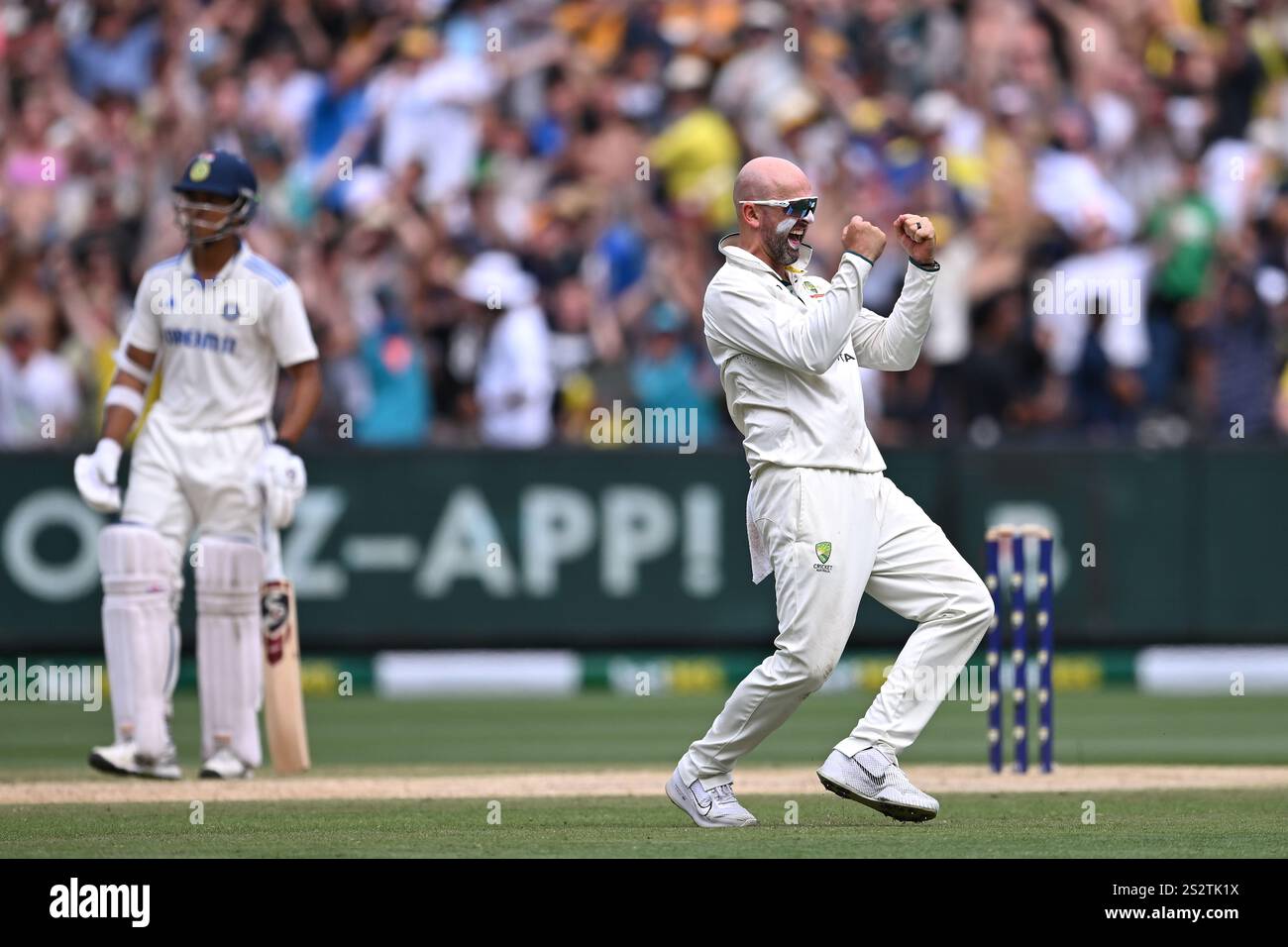 Melbourne, Australia. 30th Dec, 2024. Nathan Lyon of Australia (centre ...