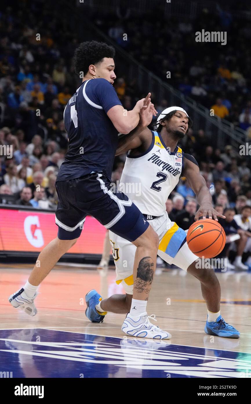 Marquette's Chase Ross is fouled by Georgetown's Caleb Williams during ...