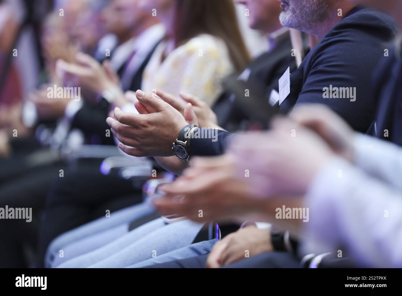Clapping hands, audience applauding at a lecture for business people ...
