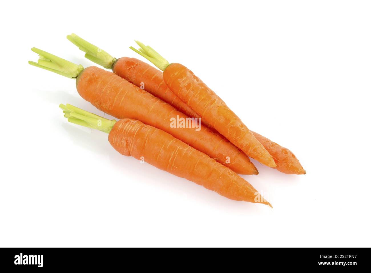 Organically grown carrots on a white background. Fresh fruit and ...