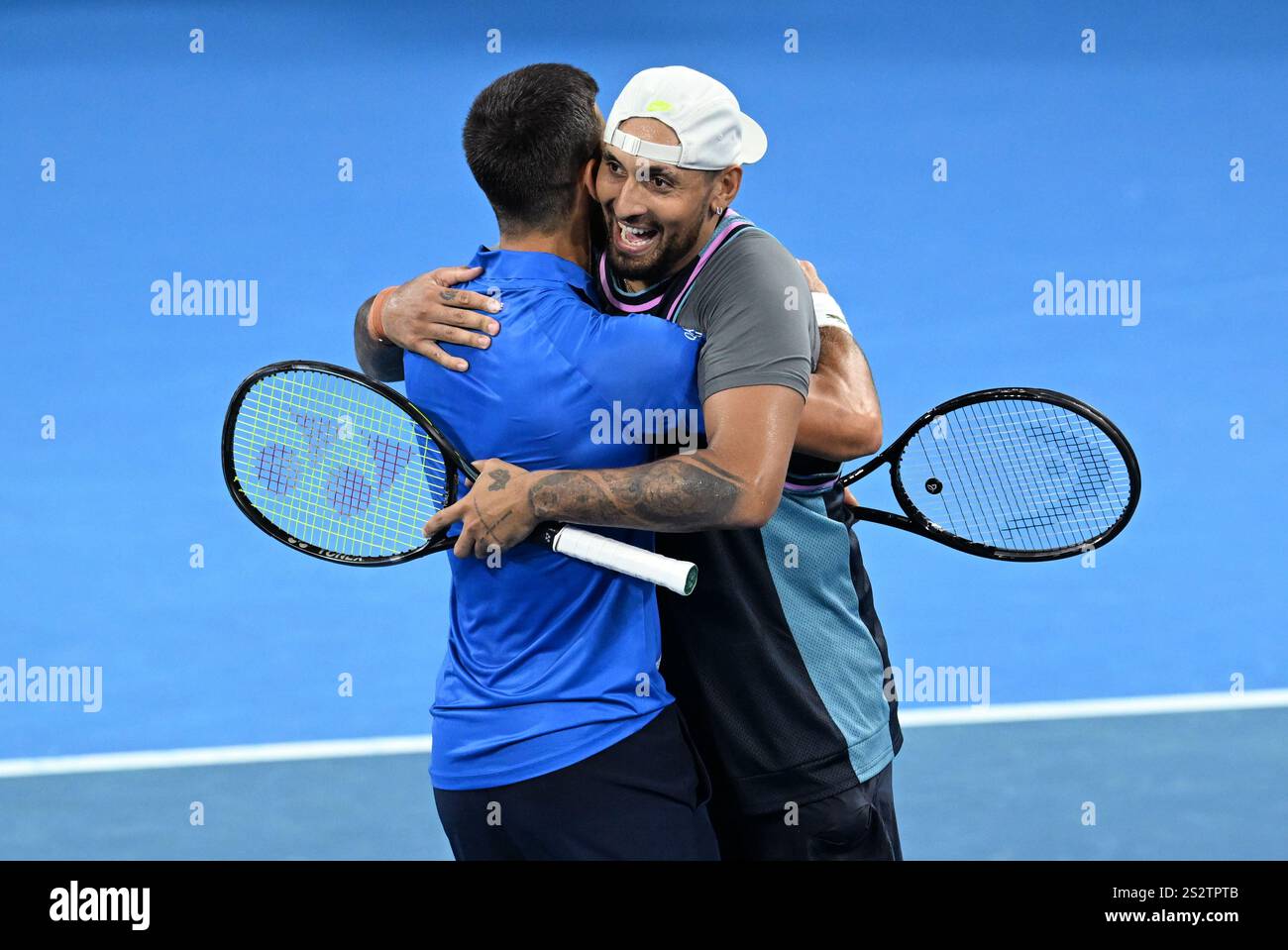 Brisbane, Australia. 30th Dec, 2024. Nick Kyrgios (right) of Australia ...