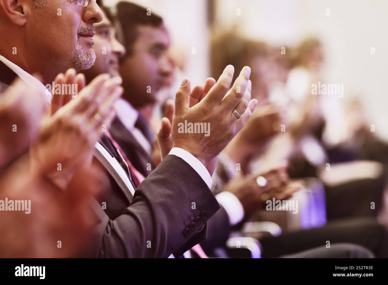 Clapping hands, audience applauding at a lecture for business people ...