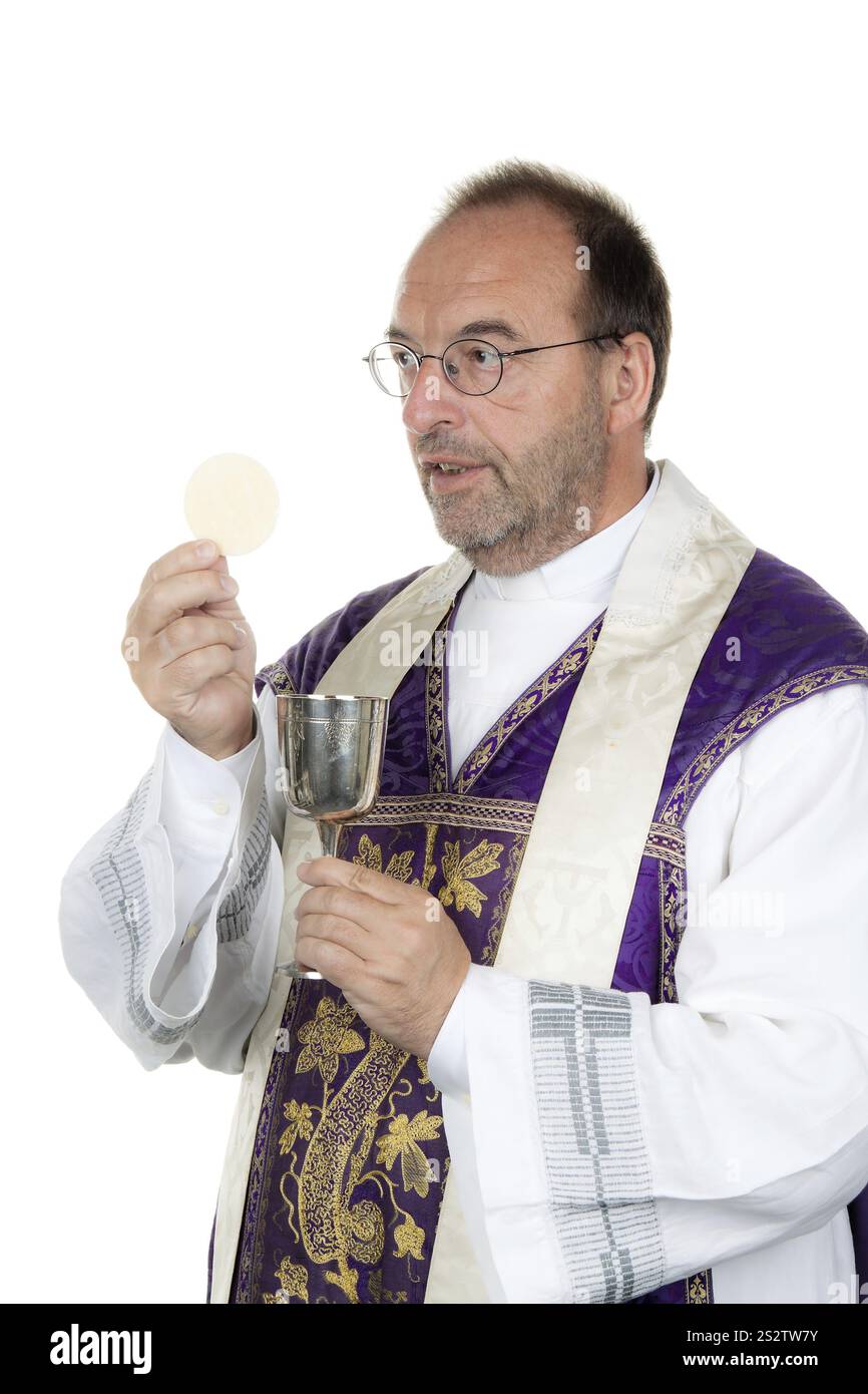 A catholic priest with chalice and host at communion Austria Stock ...