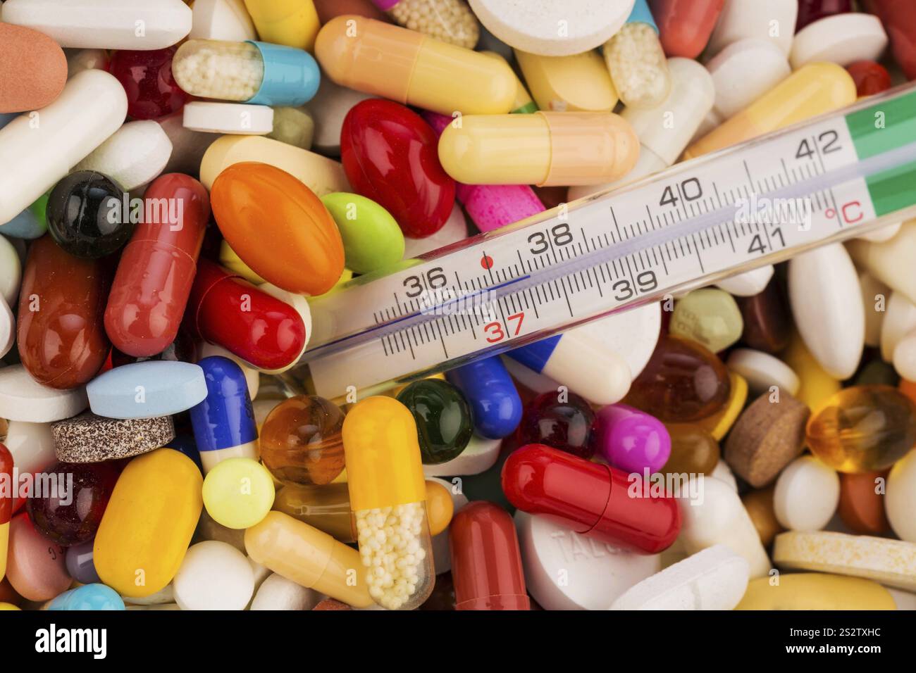 Clinical thermometer and tablets, symbolic photo for illness and ...