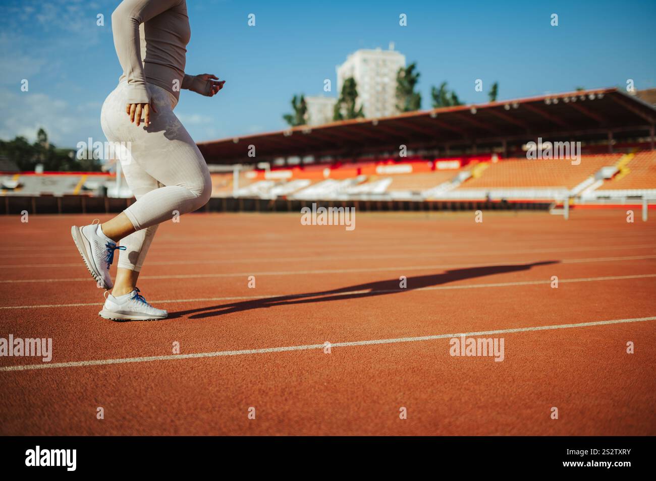 Cropped picture of an unrecognizable young female track athlete running ...