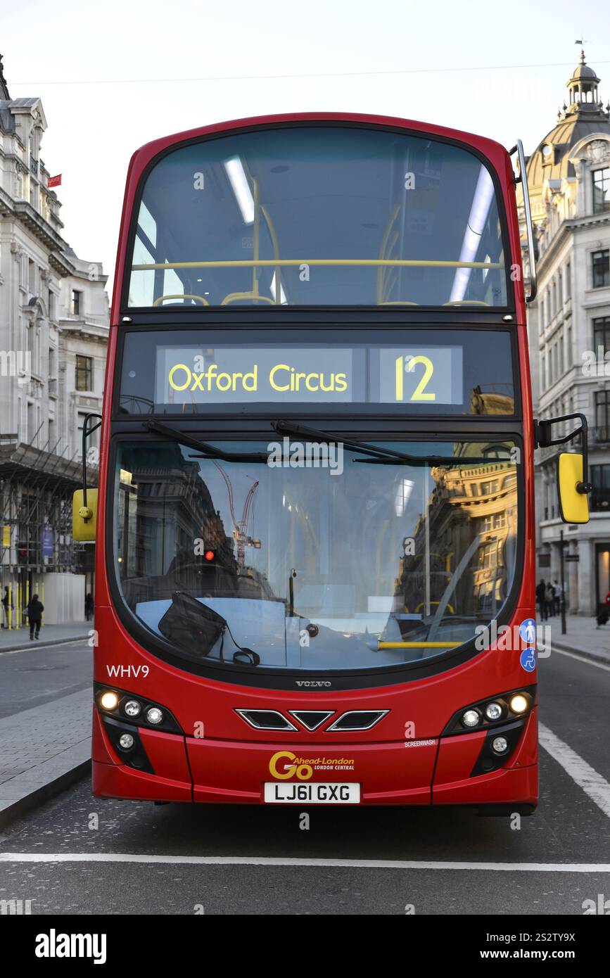 A red double-decker bus on the streets of London with destination ...