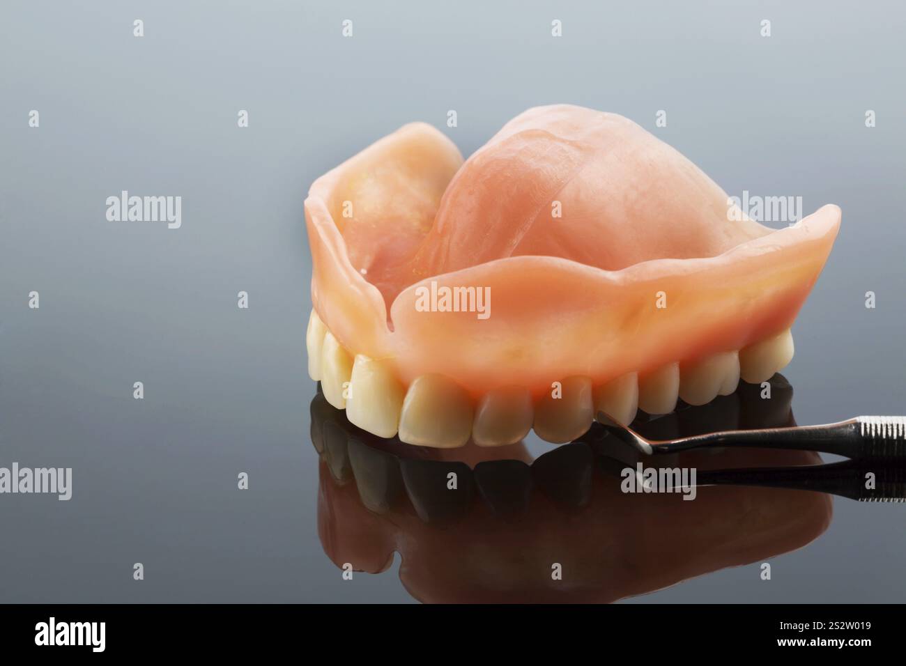 Dentures and mouth mirror, symbol photo for dentures, diagnostics and ...