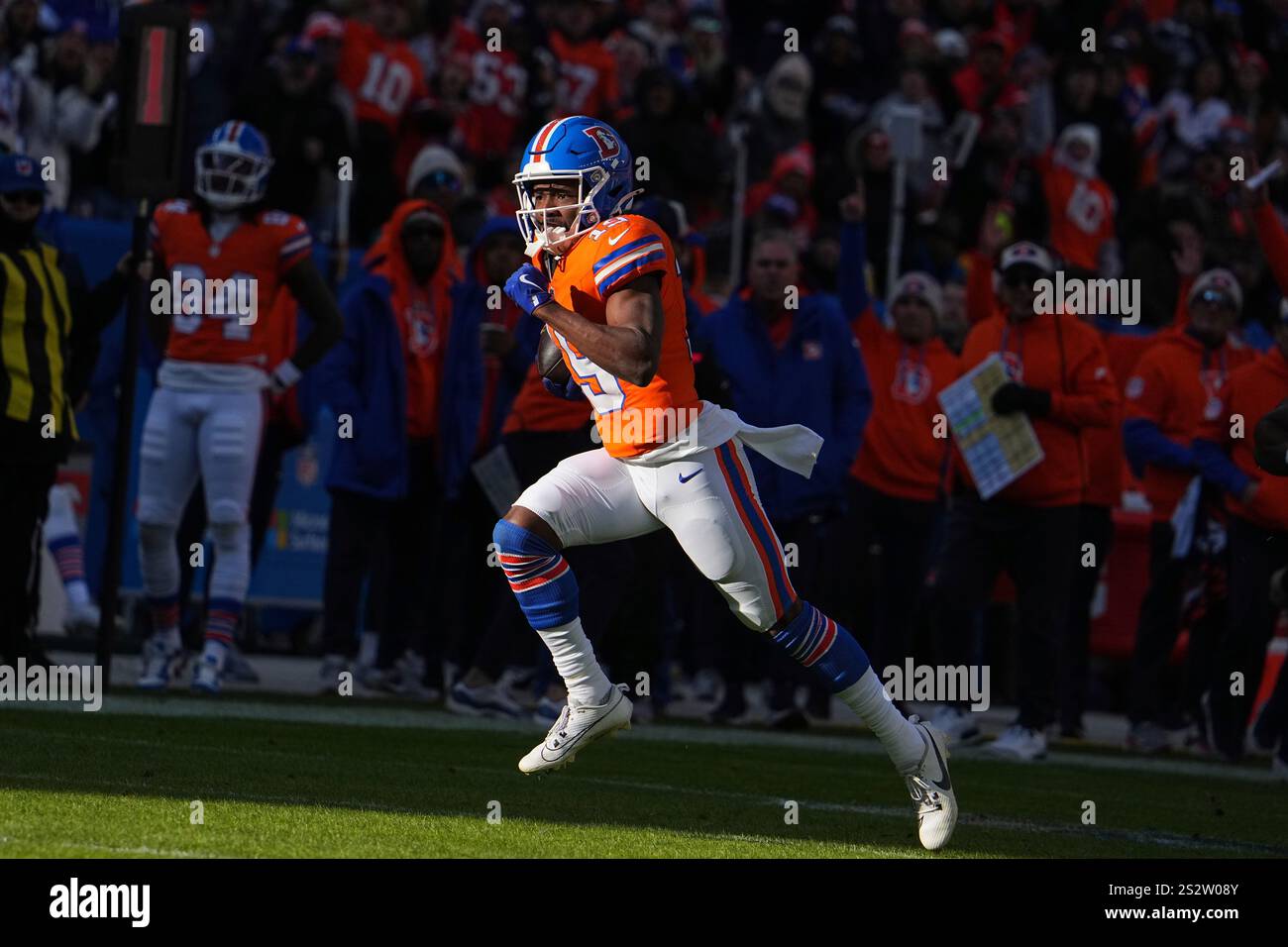 Denver Broncos wide receiver Marvin Mims Jr. (19) runs for a touchdown ...