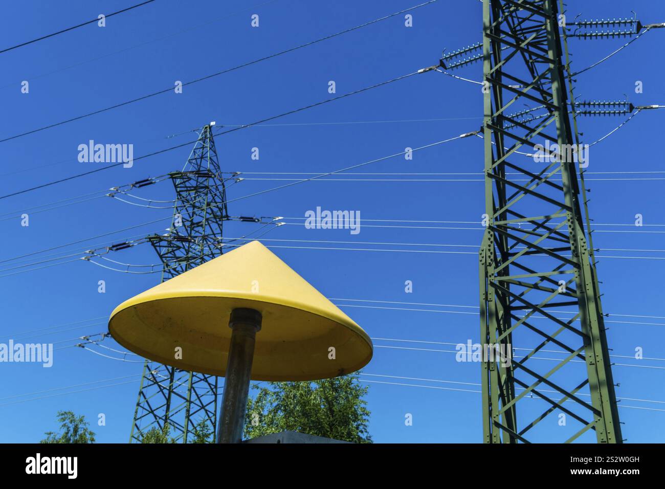 A gas pipeline and an electricity pylon of a high-voltage power line ...