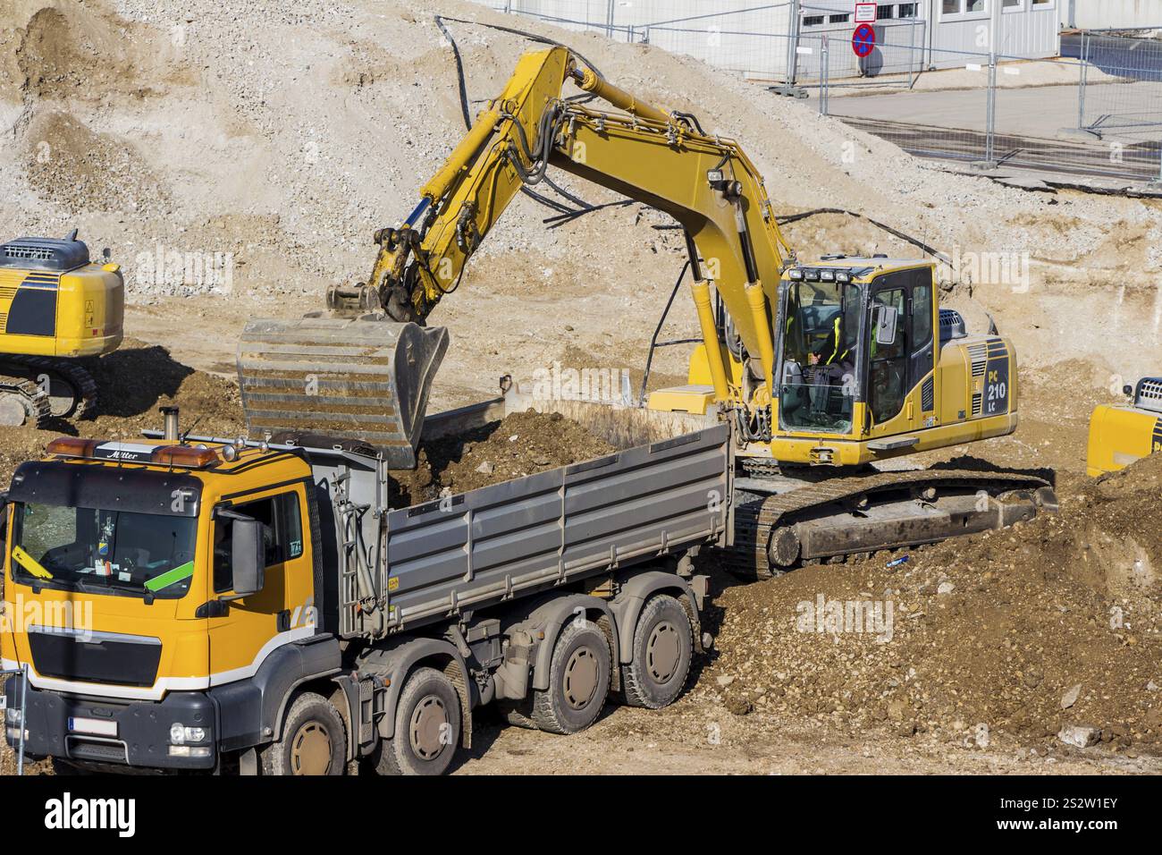Excavator on a building site. Excavator shovel with earth, earthworks ...