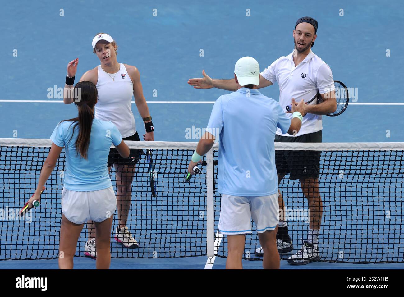 Tim Puetz and Laura Siegemund of Germany are congratulated by Dmitry ...
