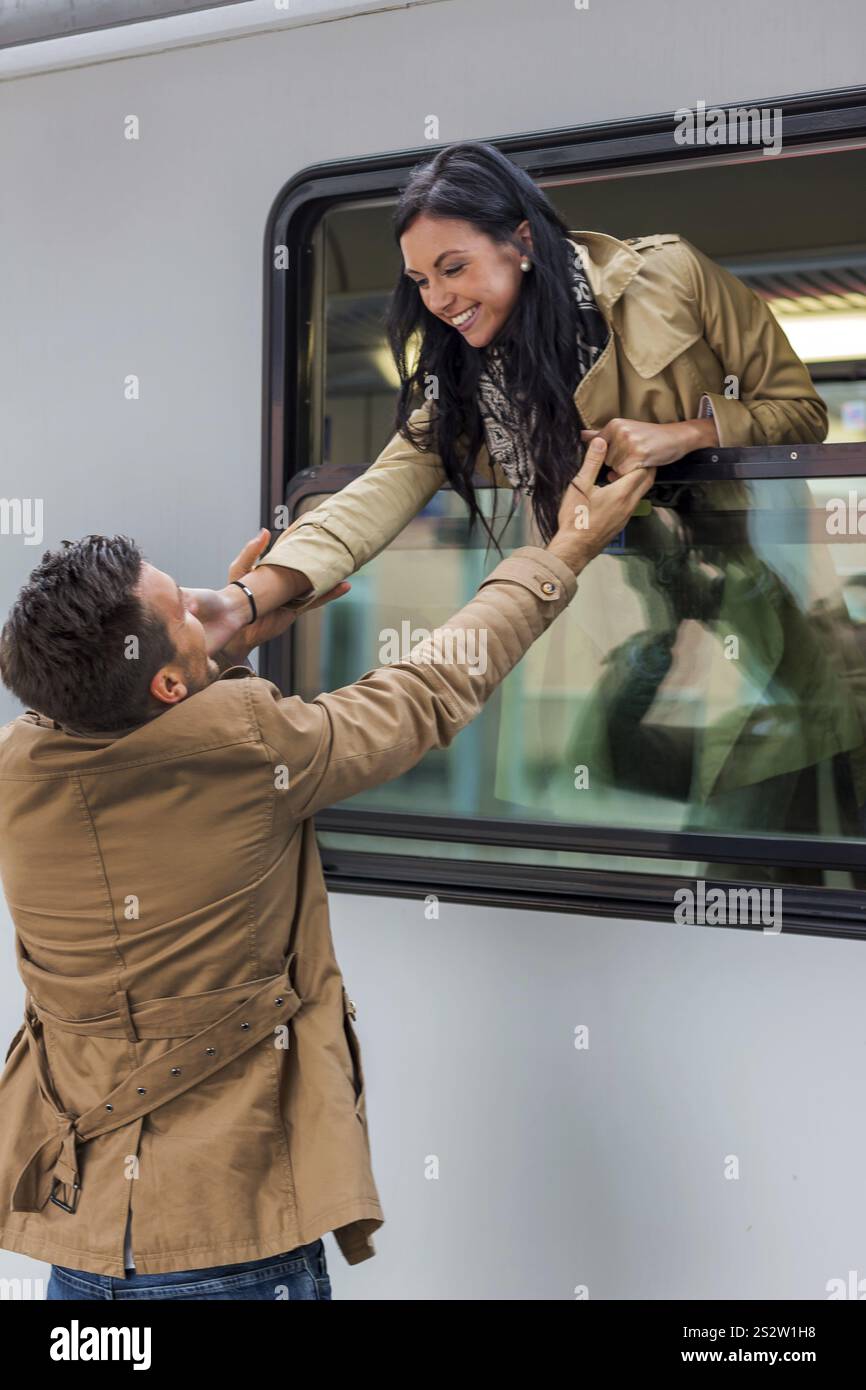 Parr arriving or saying goodbye on a platform at a railway station ...