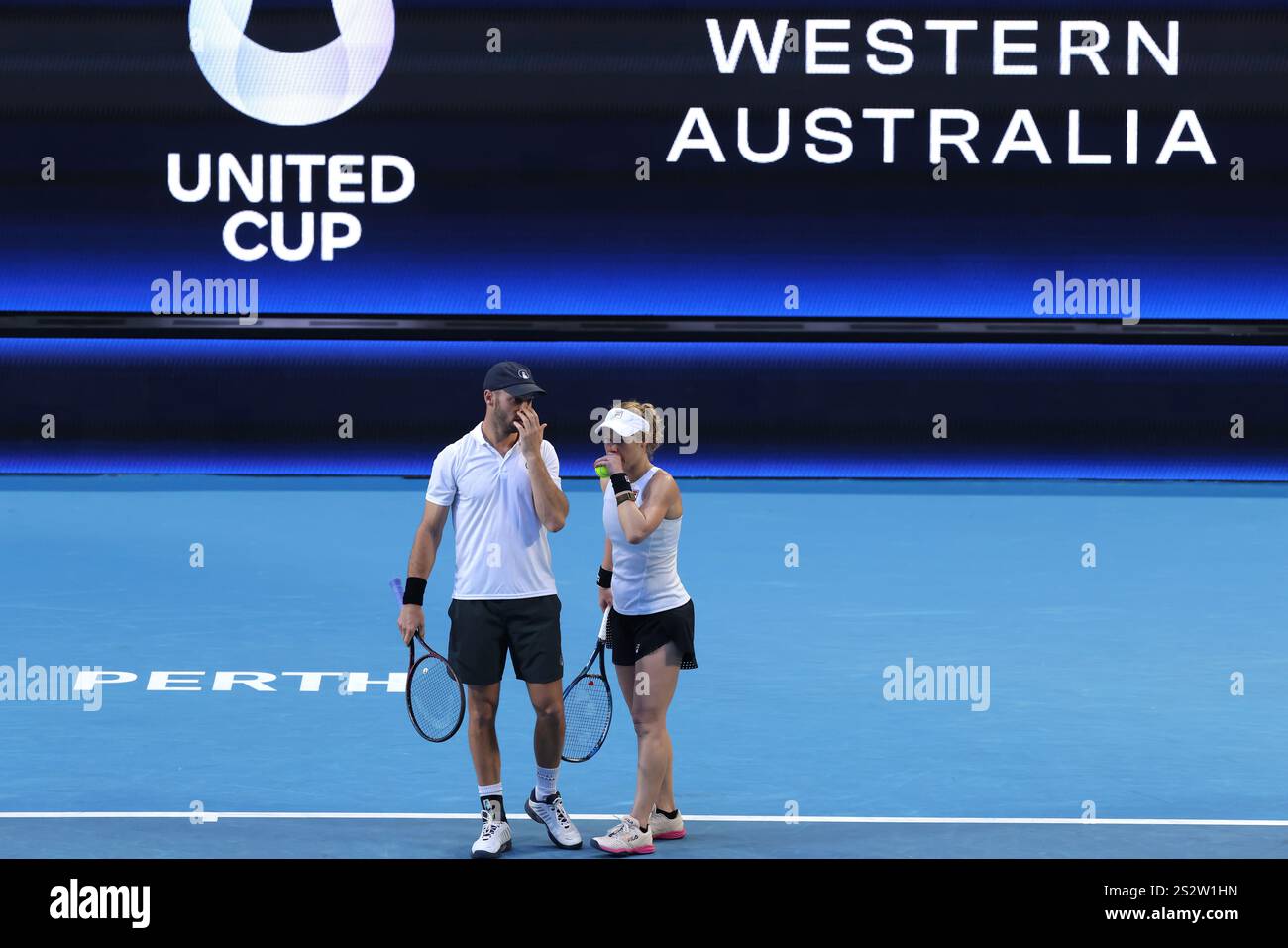 Tim Puetz and Laura Siegemund of Germany in action against Dmitry Popko ...