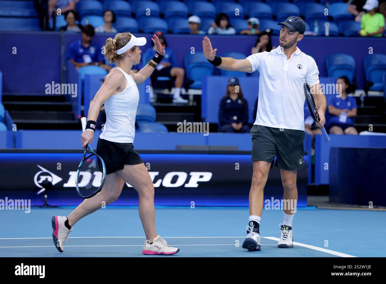 Tim Puetz and Laura Siegemund of Germany in action against Dmitry Popko ...
