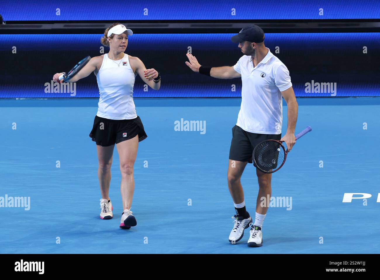 Tim Puetz and Laura Siegemund of Germany in action against Dmitry Popko ...