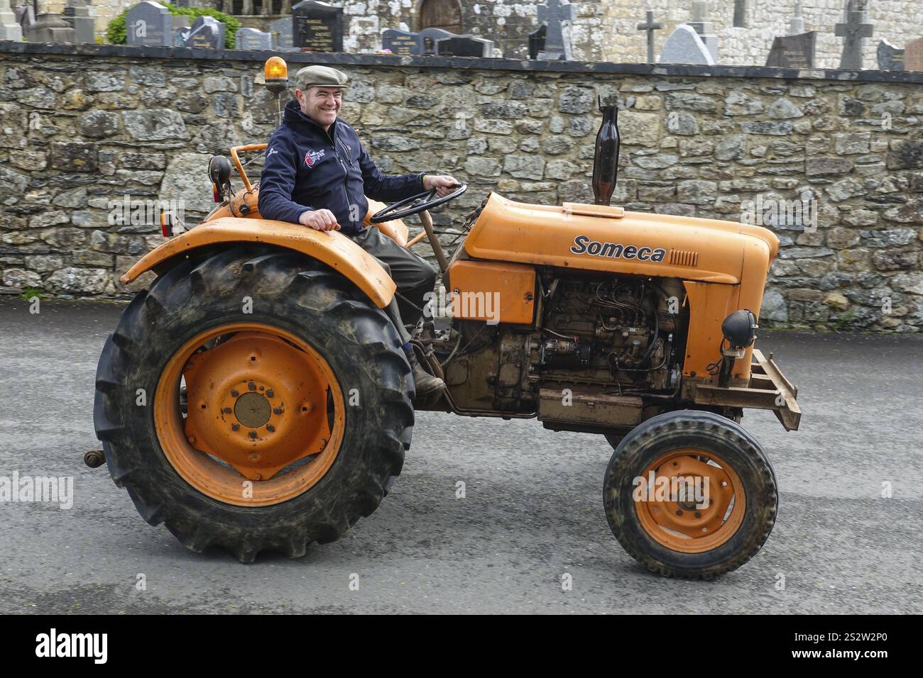 Old tractor Someca in front of church and chapel Sainte Nonne, vintage ...
