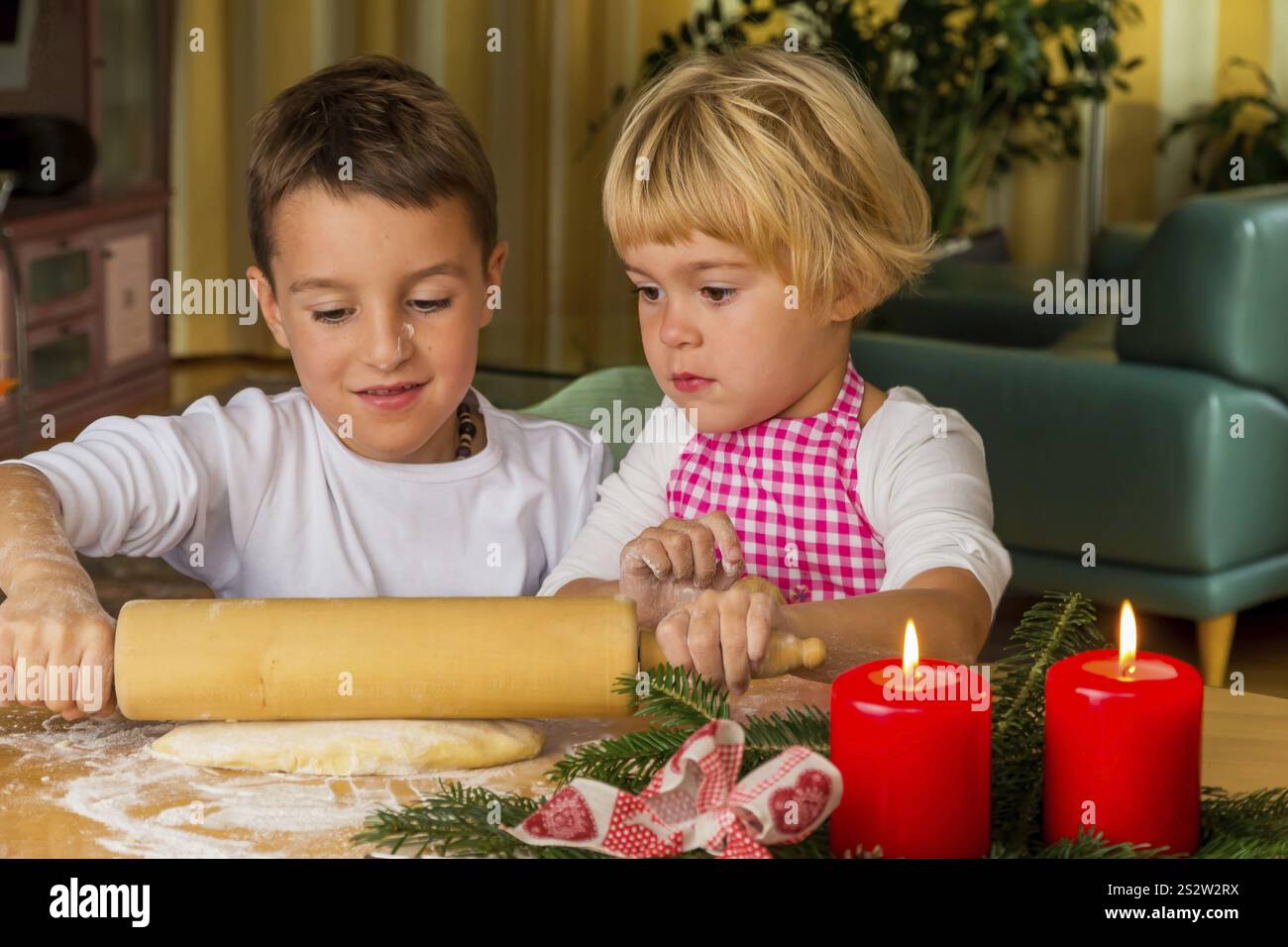 Children bake biscuits for Christmas. Biscuits for the Advent season ...