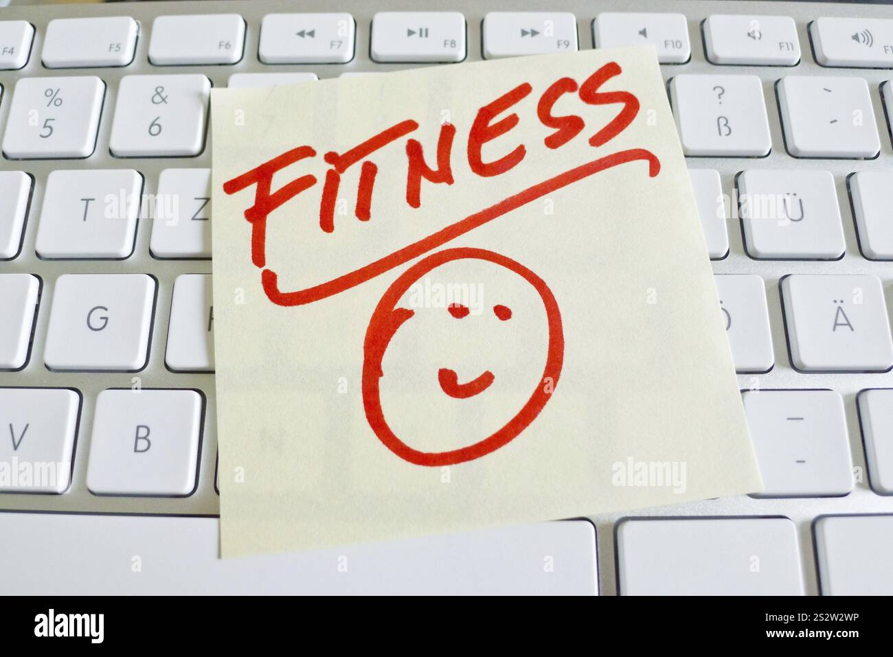 A note on the keyboard of a computer as a reminder: Fitness Austria ...