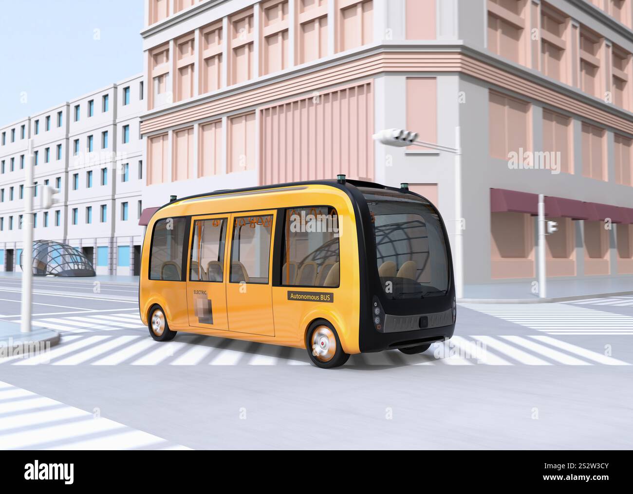 Image of a yellow automated bus passing through an intersection Stock ...