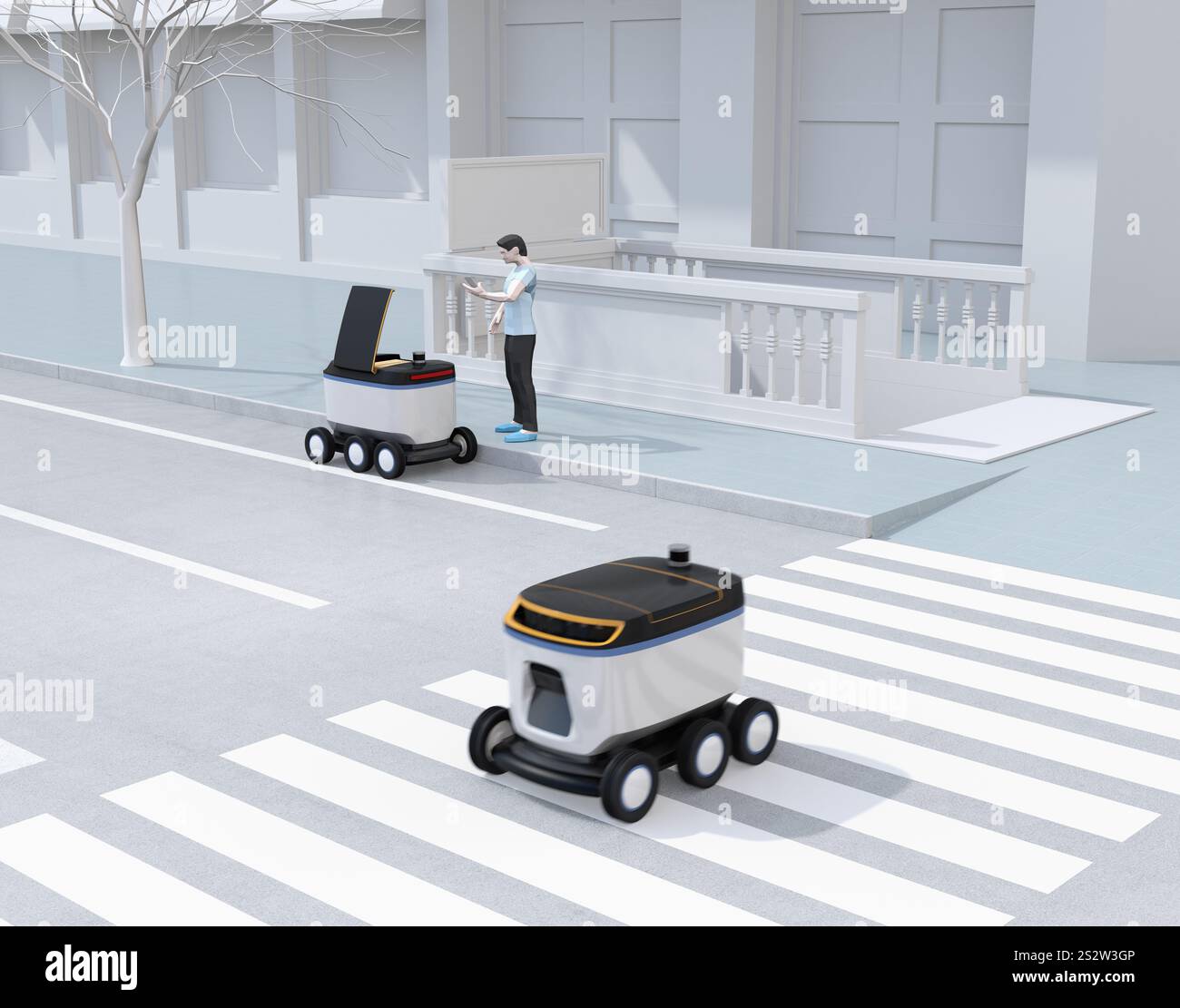 Delivery robot passing through an intersection. A person receiving a ...