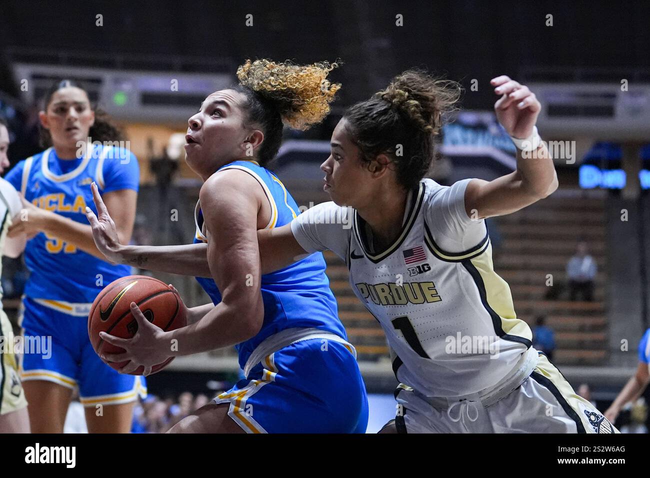 Purdue guard Amiyah Reynolds (1) reaches around UCLA guard Kiki Rice (1 ...