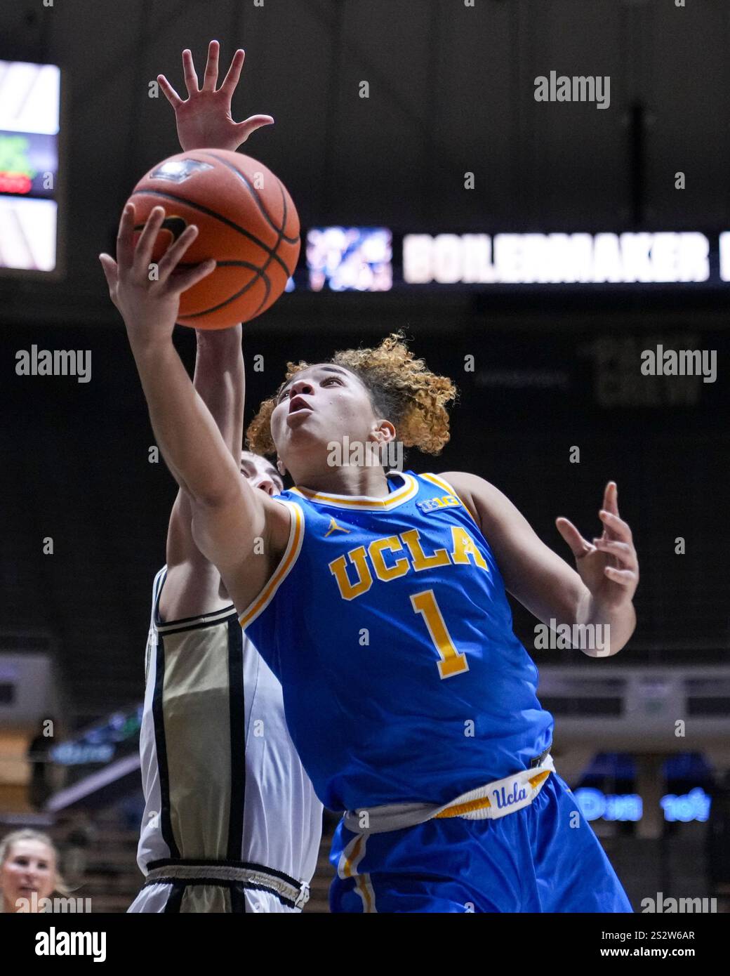 UCLA guard Kiki Rice (1) shoots in front of Purdue forward Reagan Bass ...