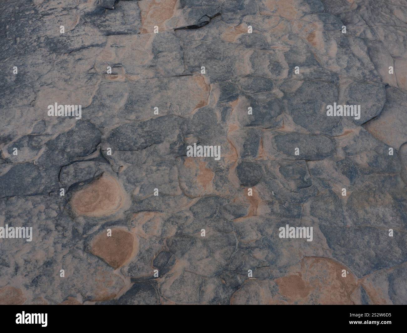 Brown stain with line cracks and roughness on the surface of the gray ...