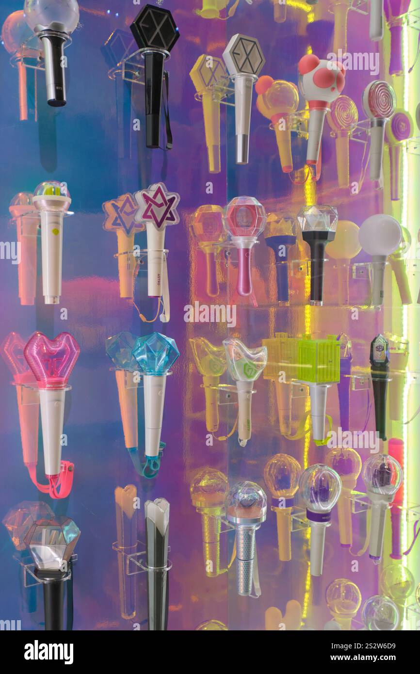Various plastic KPop, band light sticks, microphones. In a pop culture ...