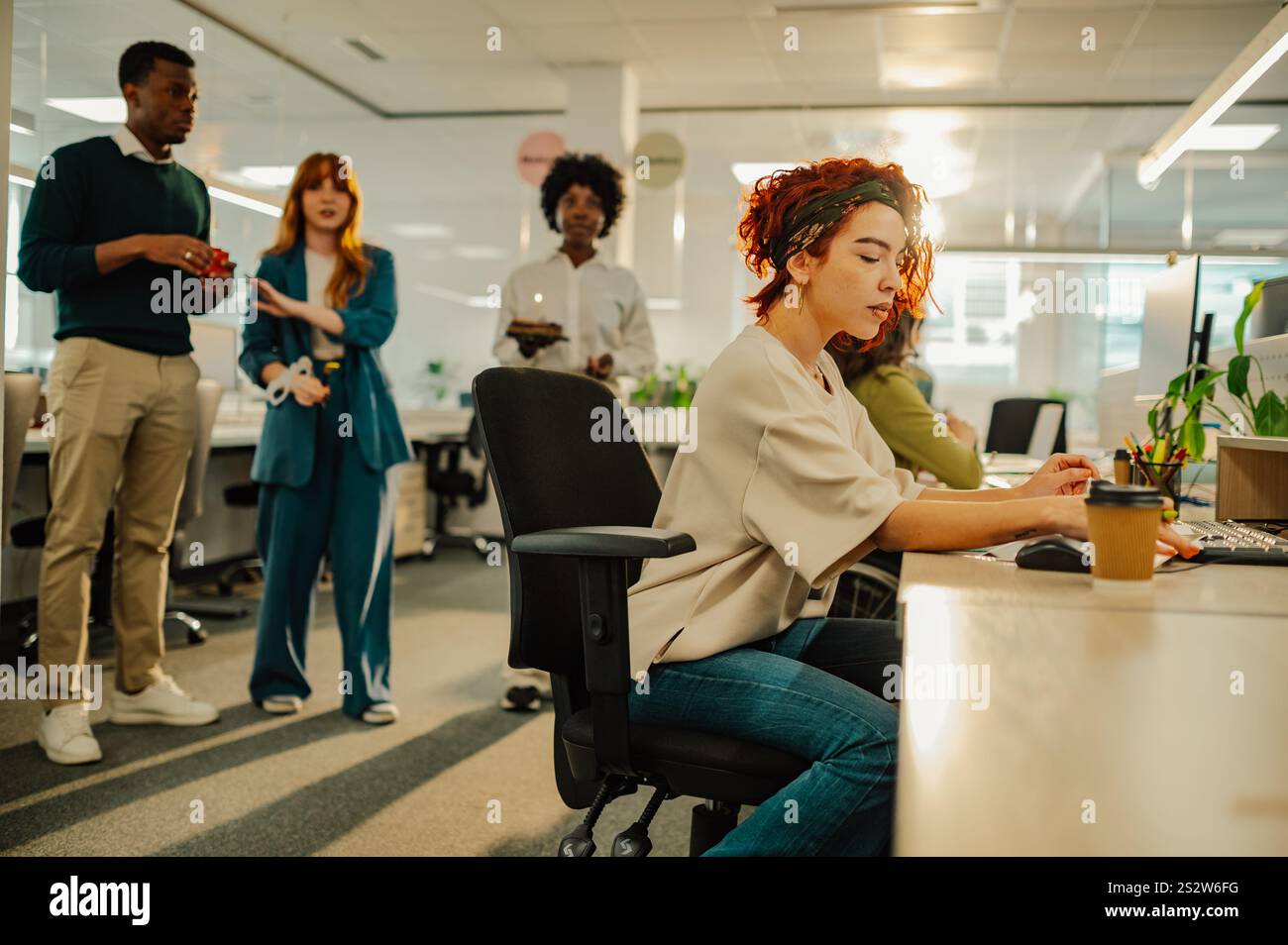 Hispanic latino business woman sitting at her desk at work with her ...
