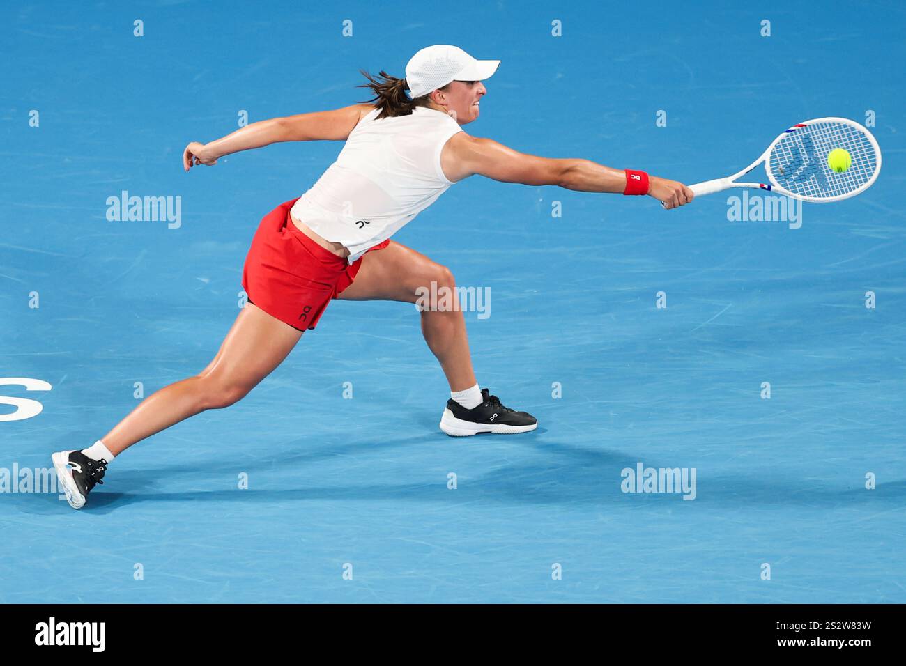 Iga Swiatek of Team Poland plays a backhand in her quarter-final match ...