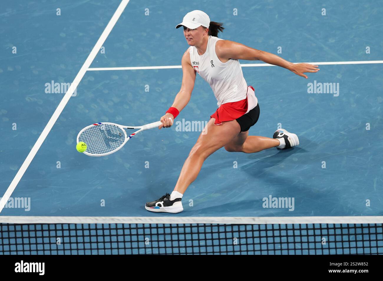 Iga Swiatek of Team Poland plays a forehand in her quarter-final match ...