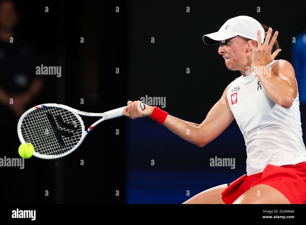 Iga Swiatek of Team Poland plays a forehand in her quarter-final match ...