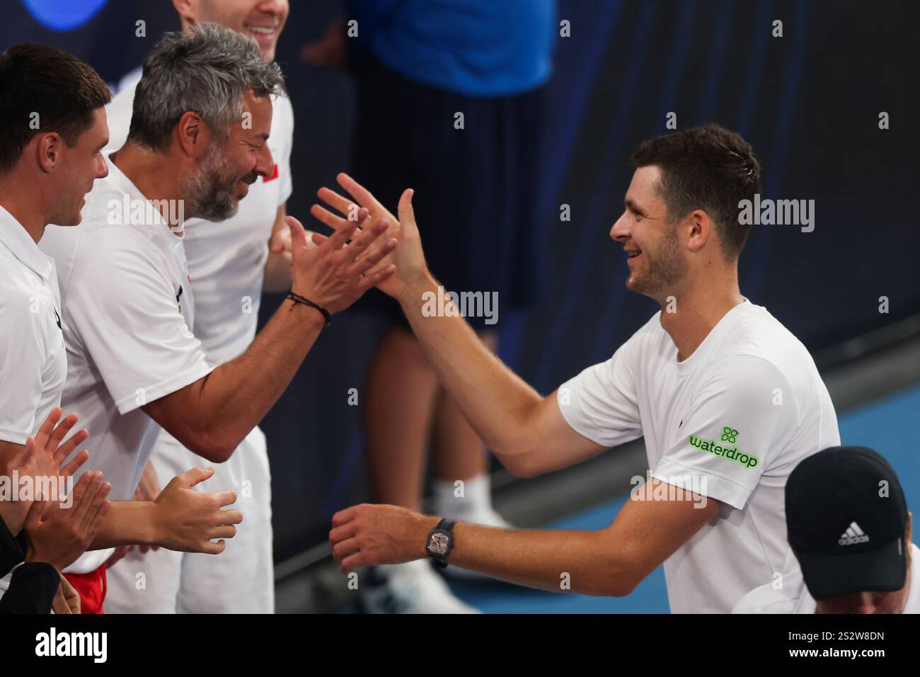 Hubert Hurkacz of Poland celebrates victory with team mates in the ...