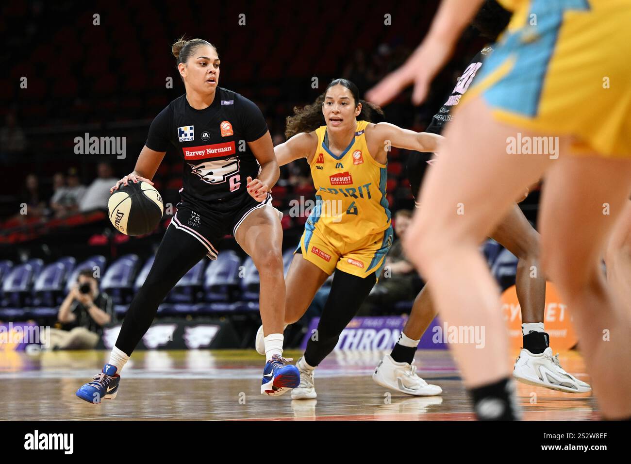 Shaneice Swain of the Flames and Veronica Burton of the Spirit during ...