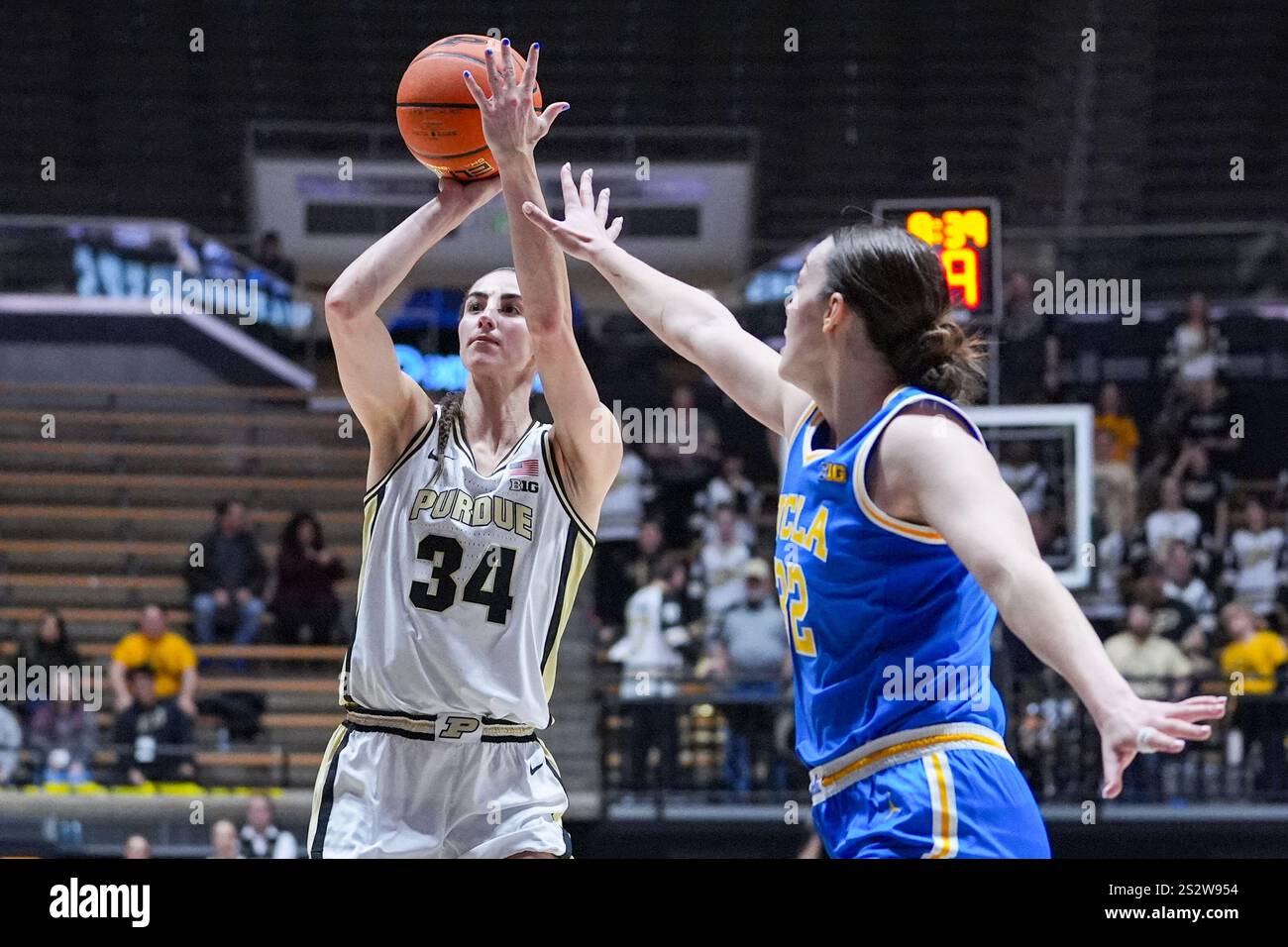 Purdue forward Reagan Bass (34) shoots over UCLA forward Angela Dugalic ...