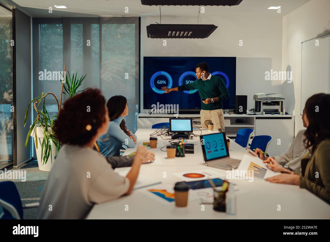 African american man team leader presenting project to its diverse ...
