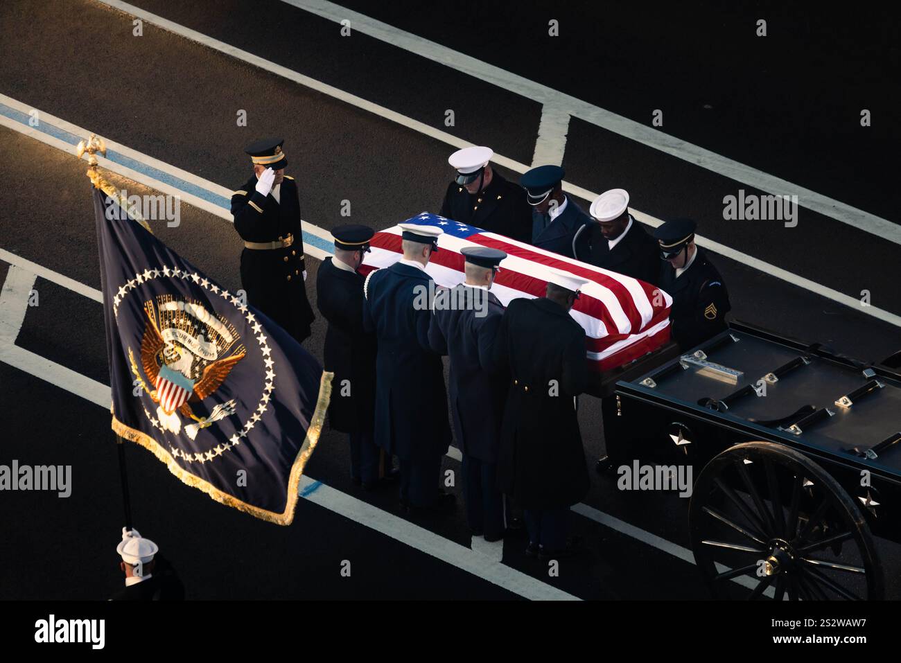 A Ceremonial Honor Guard Joint Service Casket Team prepares to place the casket of former ...
