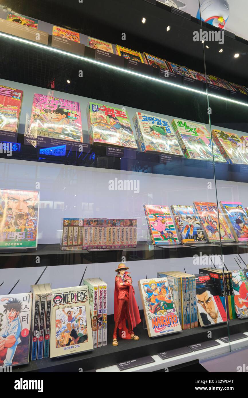 Anime books and a figure, doll. In a pop culture show at the National ...