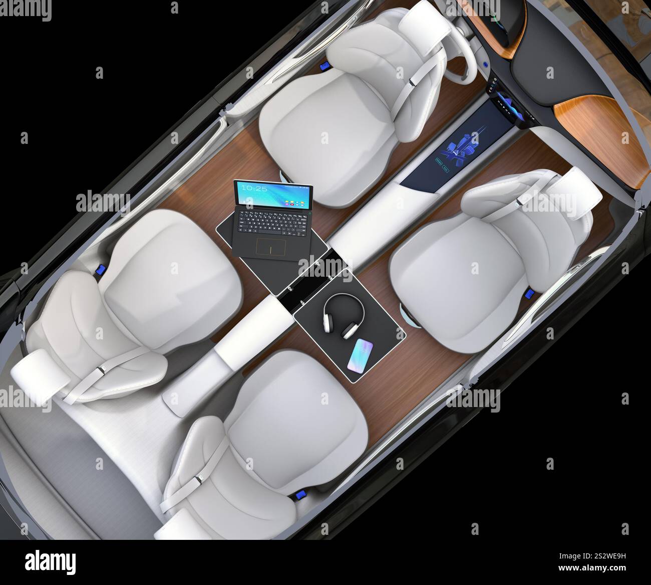 Front seats of an automated vehicle facing backwards, laptop on a ...