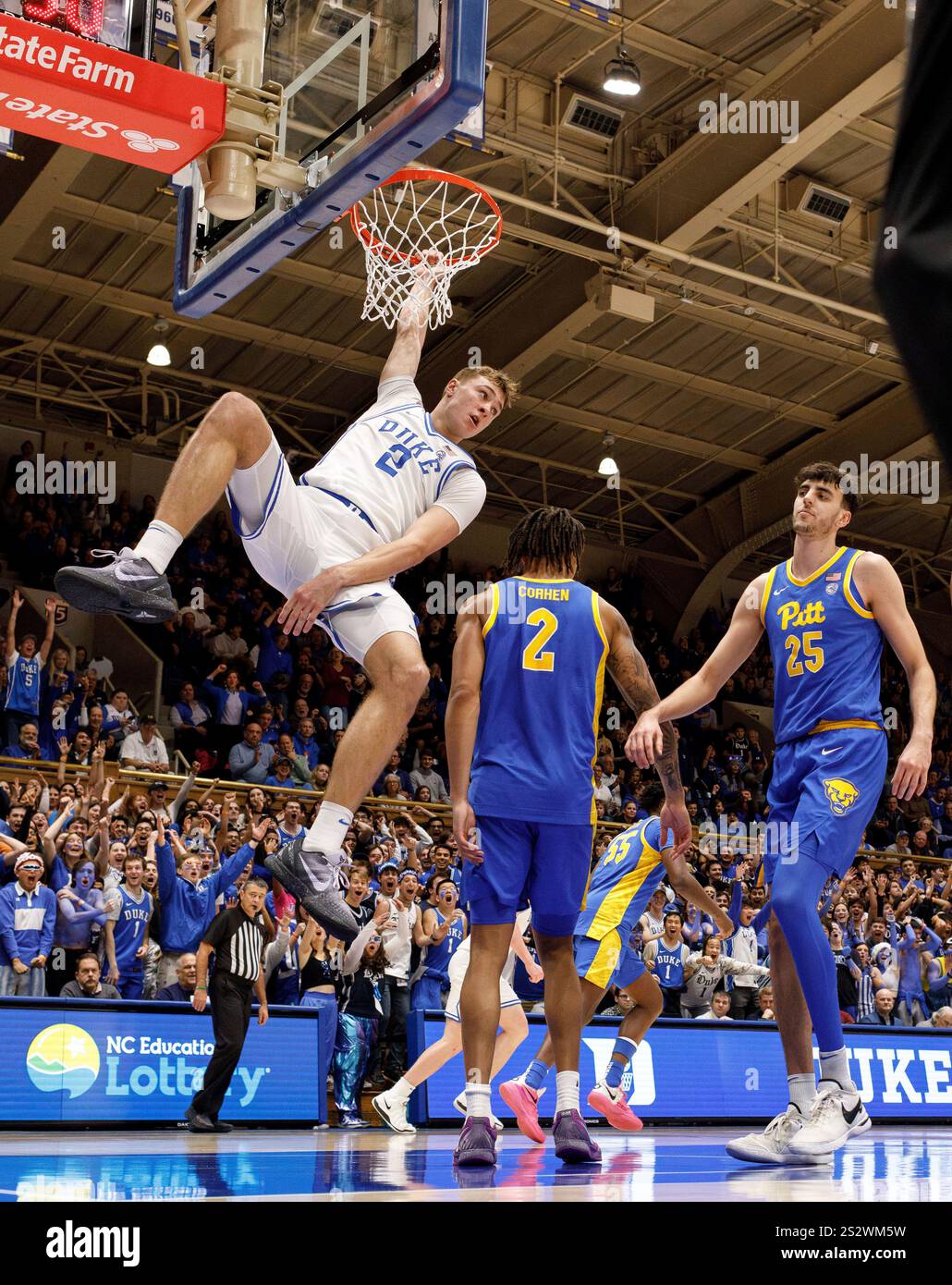 Duke's Cooper Flagg, left, finishes a dunk ahead of Pittsburgh's ...