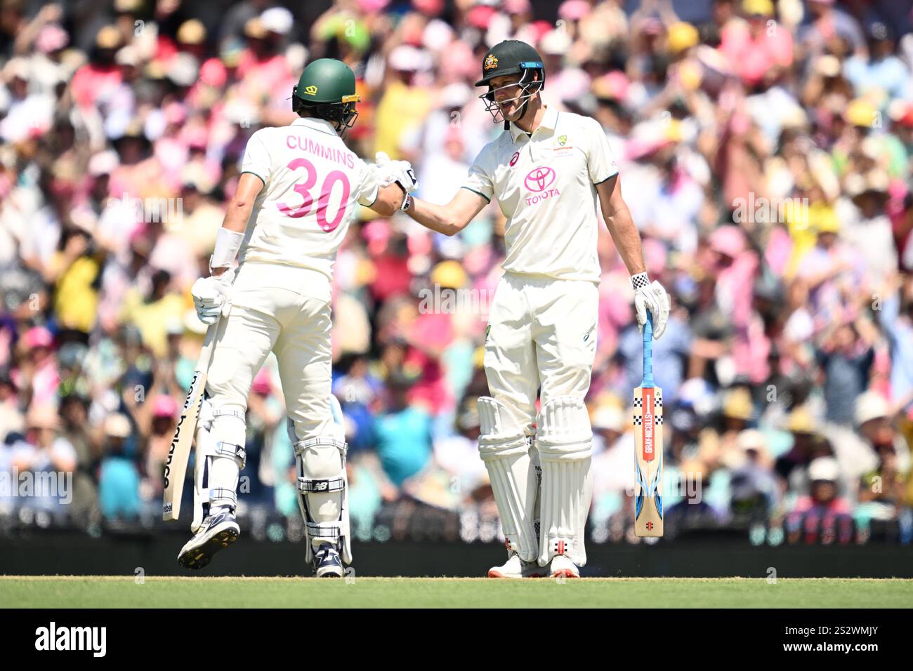 Beau Webster of Australia (right) is congratulated by Pat Cummins after ...