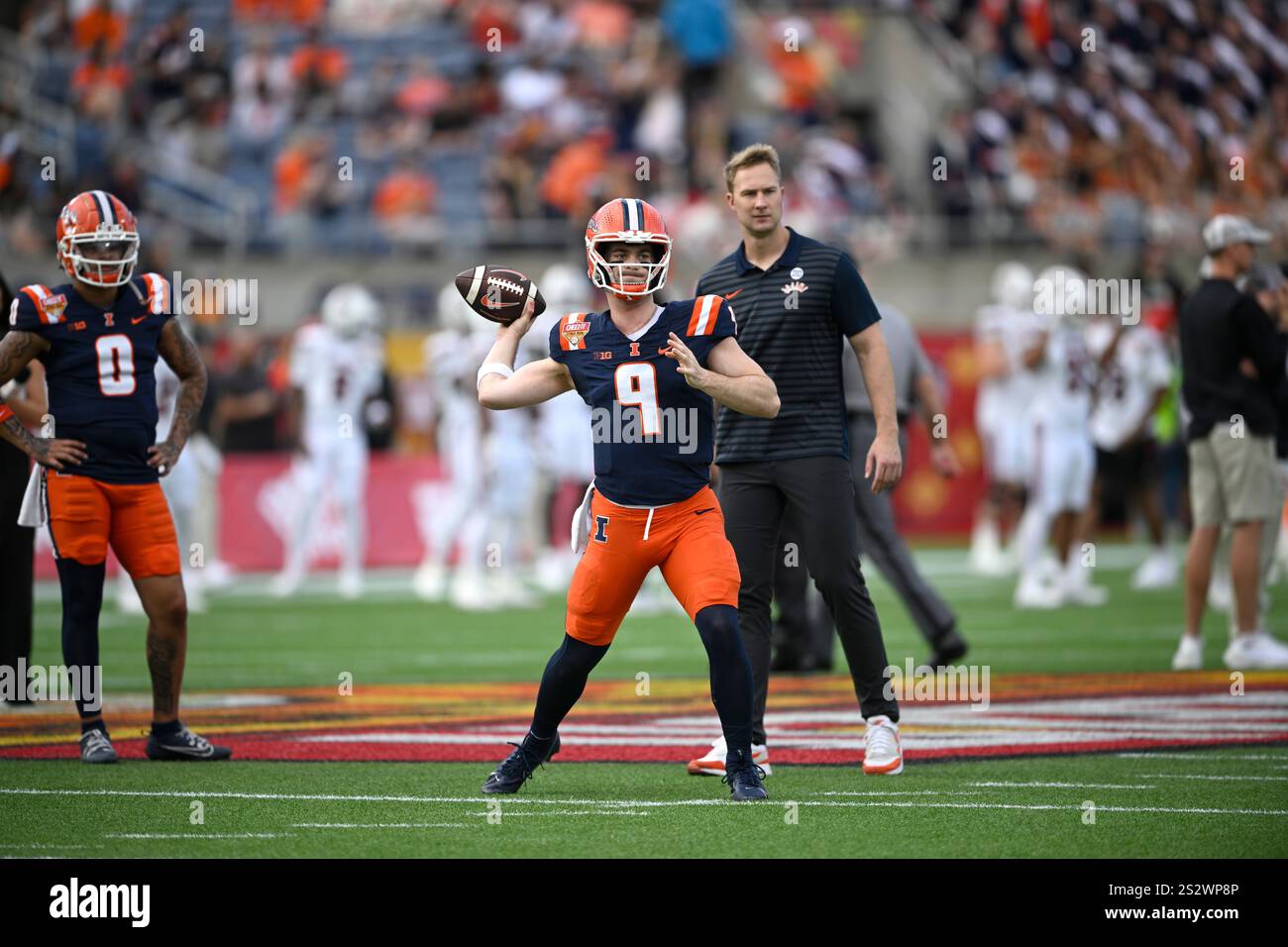 Illinois quarterback Luke Altmyer (9) warms up before the Citrus Bowl ...