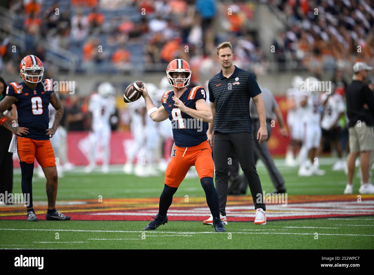 Illinois quarterback Luke Altmyer (9) warms up before the Citrus Bowl ...