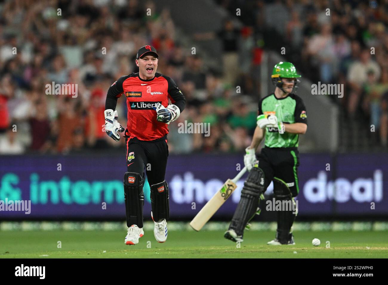 Tim Seifert of the Renegades (left) reacts after running out Sam Harper ...