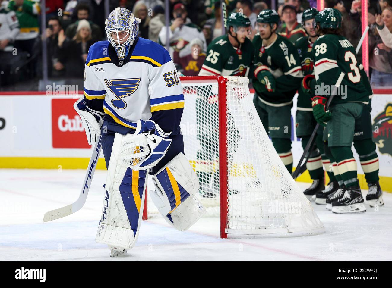 St. Louis Blues goaltender Jordan Binnington, left, reacts to Minnesota ...