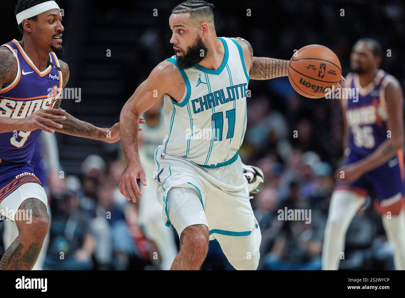 Charlotte Hornets forward Cody Martin (11) handles the ball against ...