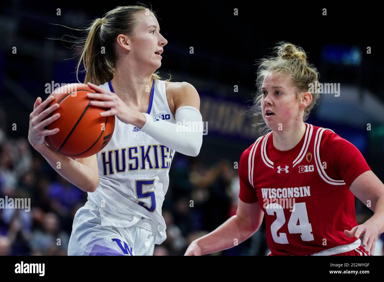 Washington guard Teagan Brown (5) grabs the rebound as Wisconsin guard ...