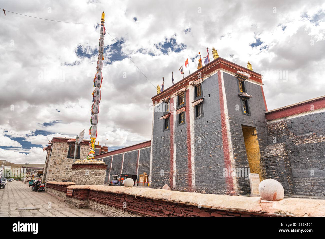 The grey houses of the Tibetan village in the West of Tibet, background ...