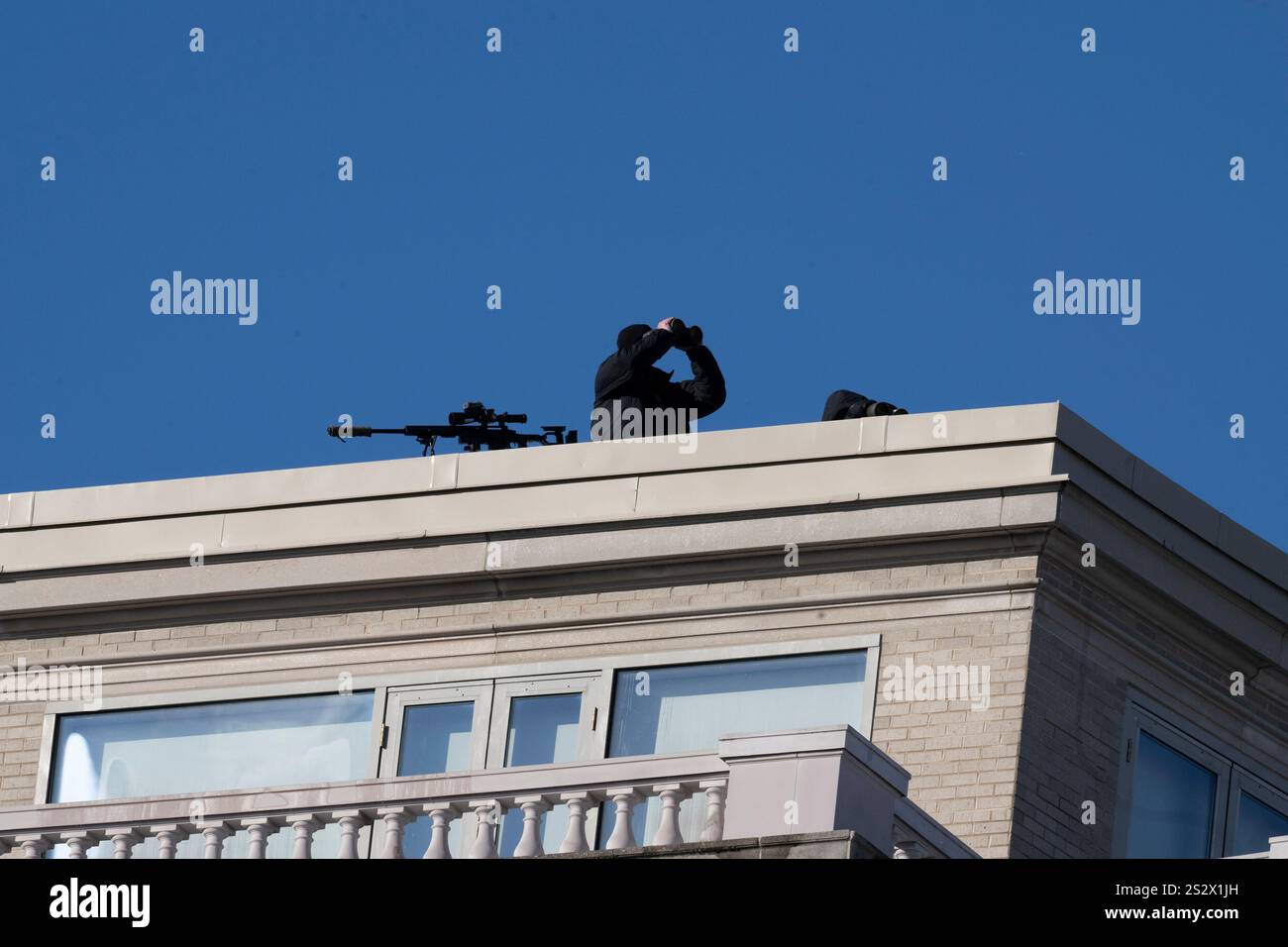Snipers perch on a rooftop near the Navy Memorial, in preparation for ...