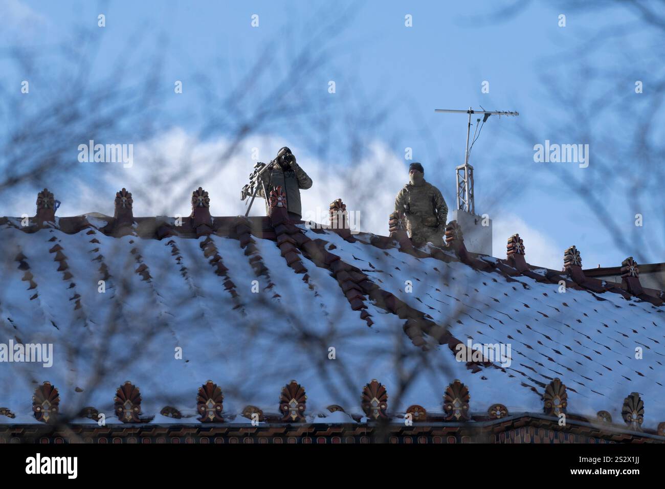 Snipers perch on a rooftop near the Navy Memorial, in preparation for ...